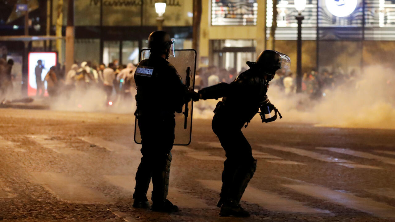 Scores arrested as PSG fans clash with police after Champions League ...