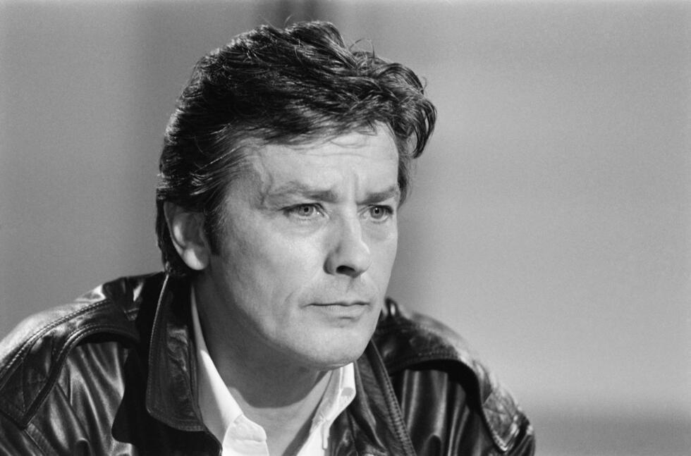 Film legend Delon is buried near his dogs as fans mourn