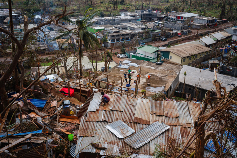 Macron declares day of national mourning for cyclone-hit Mayotte