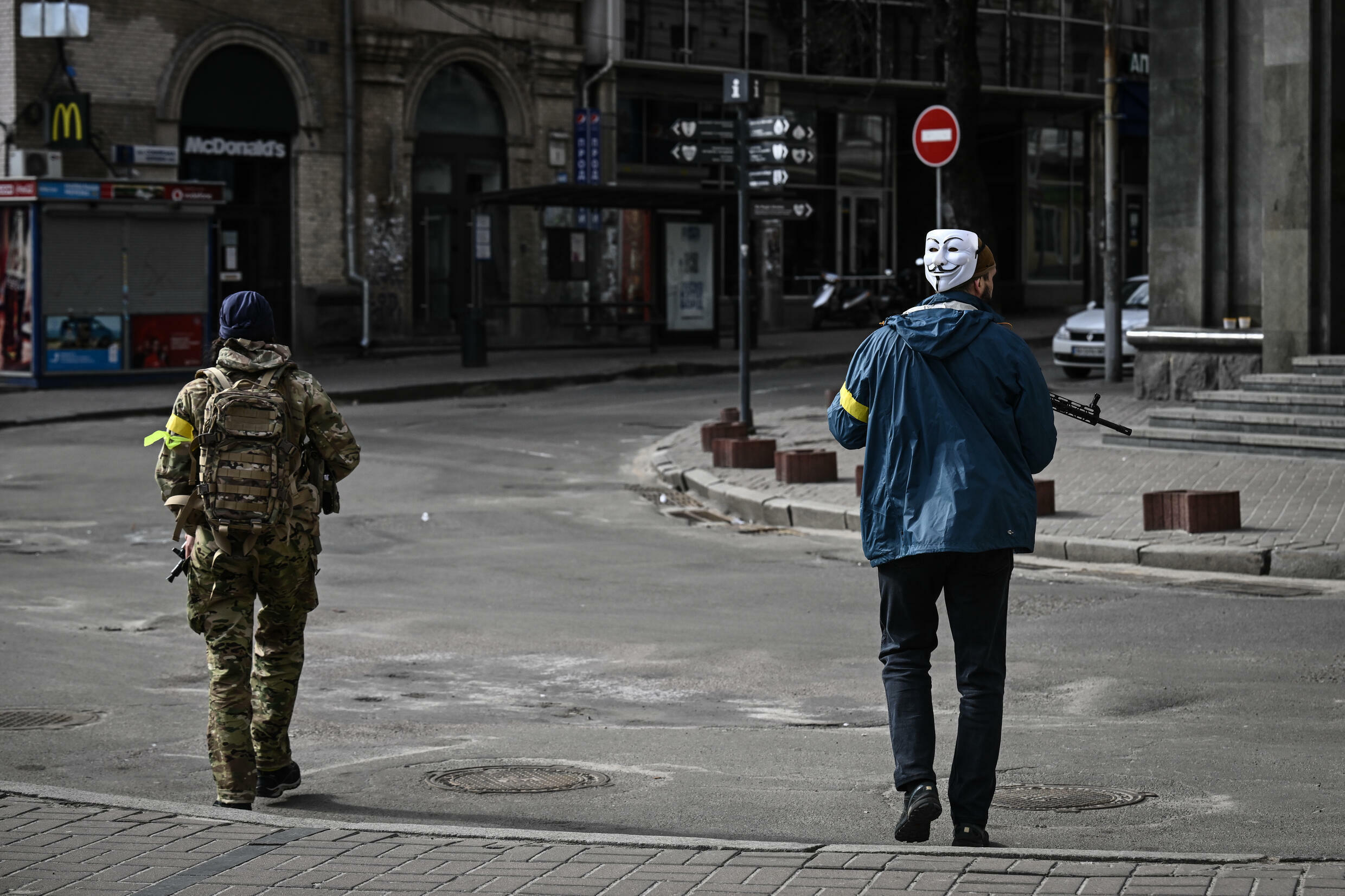Guns, blasts and smiles in Kyiv under military curfew