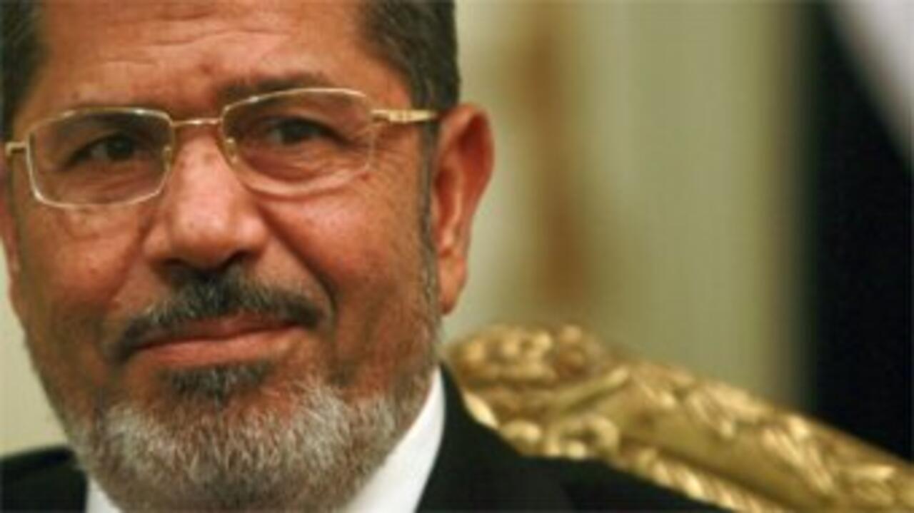 Syrian delegates walk out after Morsi slams Assad