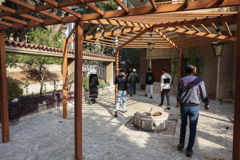 Syrians explore ousted Assad's Damascus home