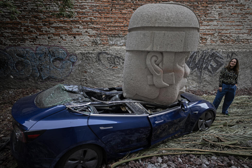 Mexican artist crushes Tesla under giant stone head