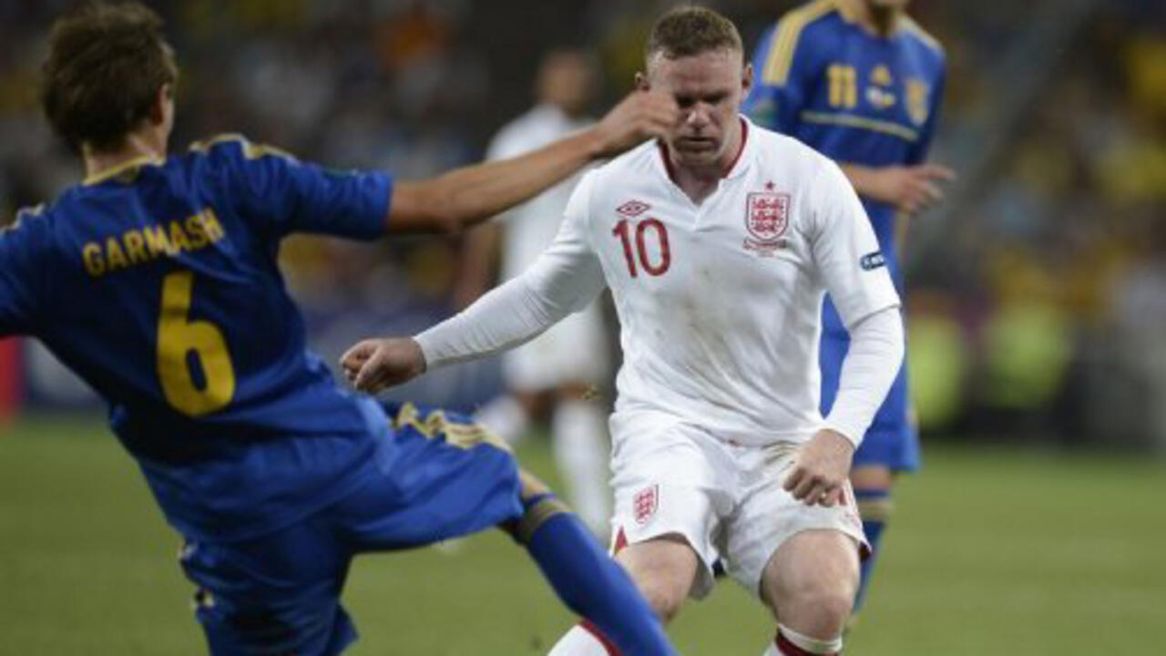 Rooney header nudges England into quarter-finals