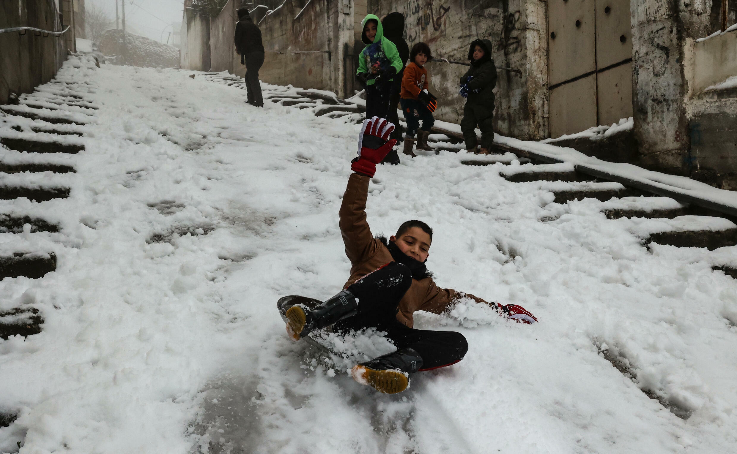 Rare Mideast snow brings Jerusalem joy, misery for Syria refugees