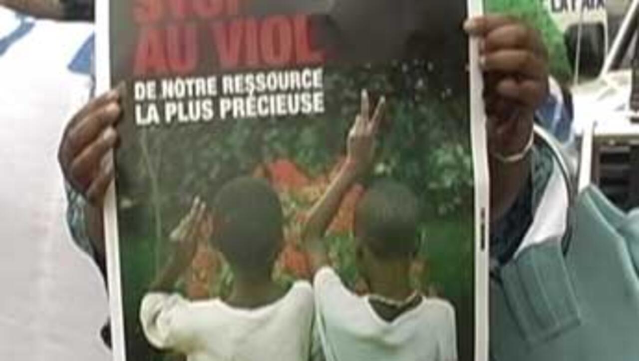 First lady leads thousands of women on march against mass rape