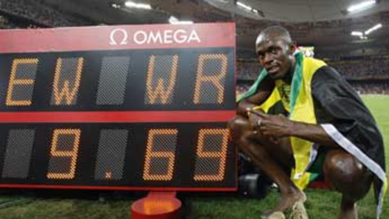 Bolt wins 100m gold in world record