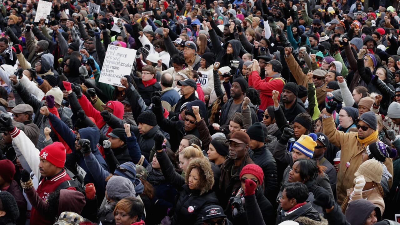 Thousands march in Washington, New York against police killings