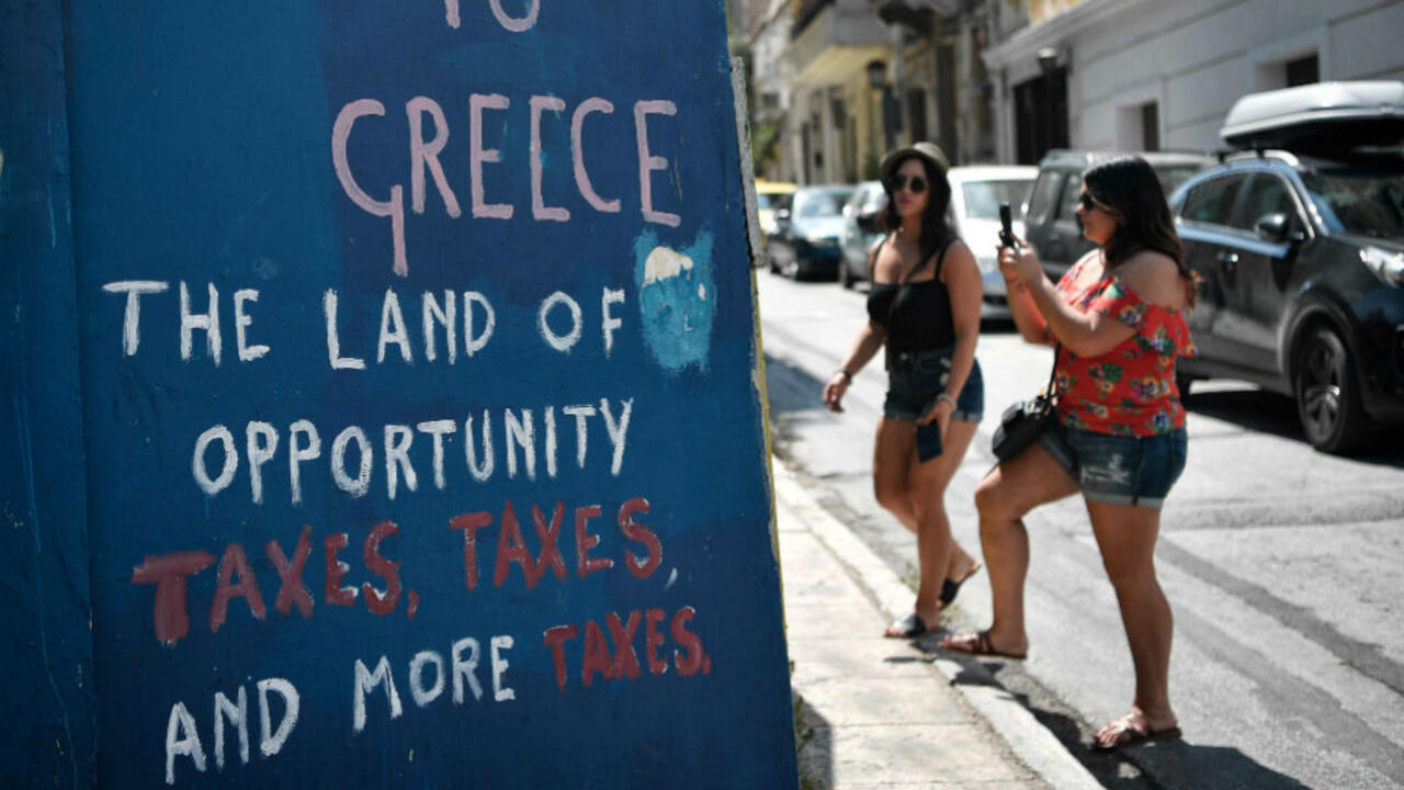 Greeks see no cause for celebration as bailout ends