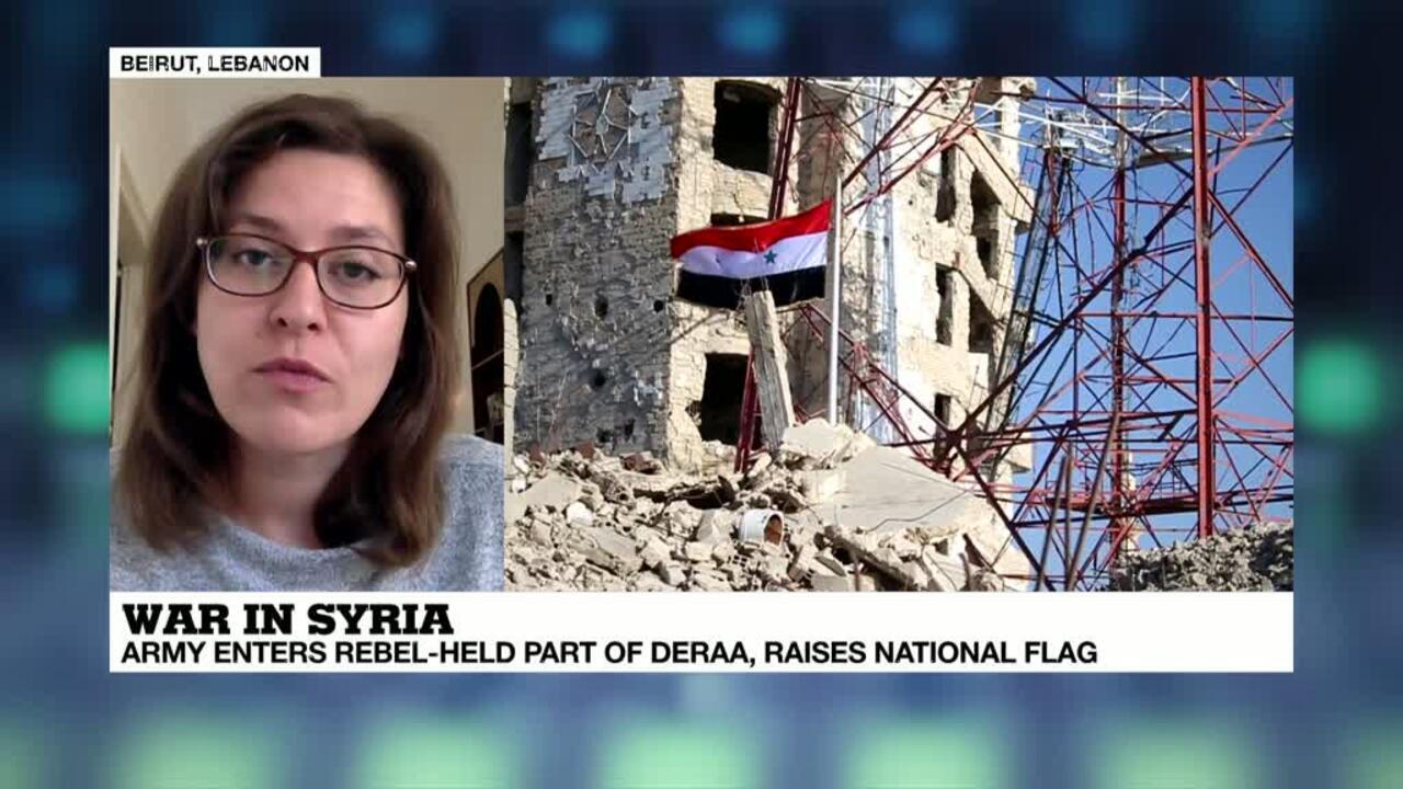 Syrian, Russian soldiers enter Deraa, raise flag, after deal with rebels