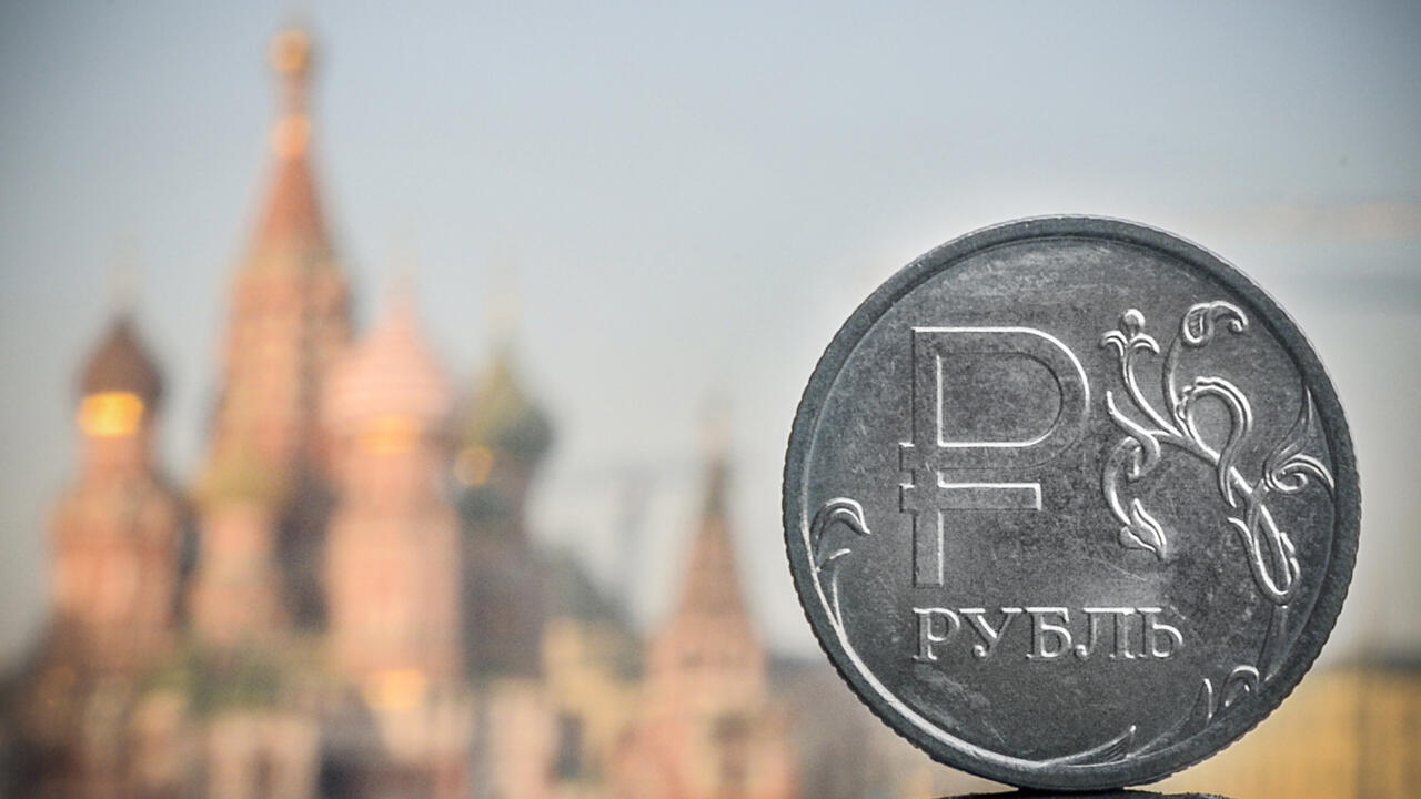 Russian ruble plunges past 100 against dollar for first time since ...