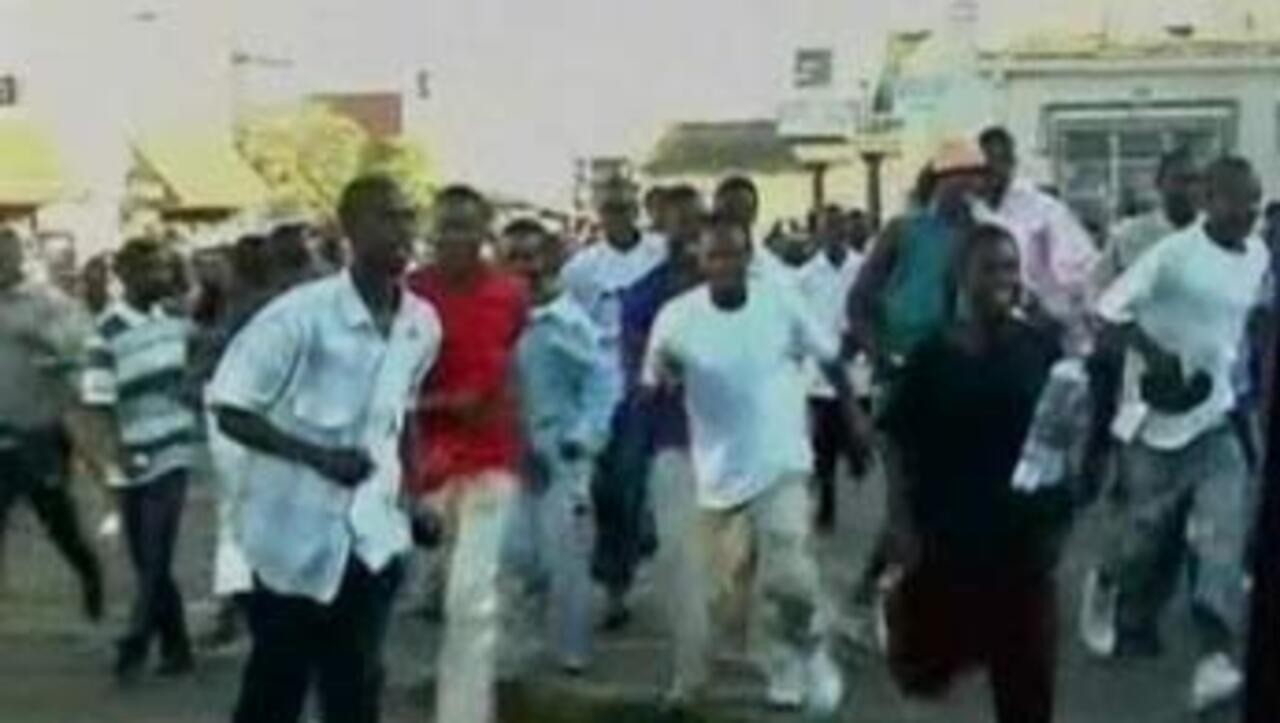 Riot police break up Harare protests