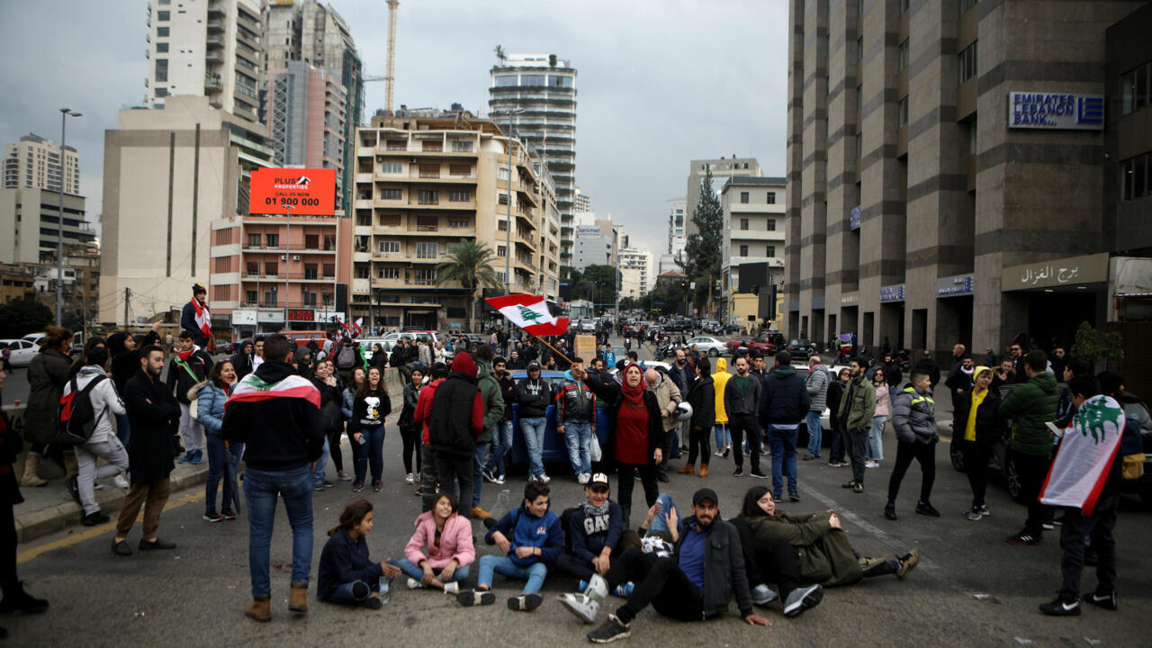 Lebanese block roads as revived protests enter fourth month