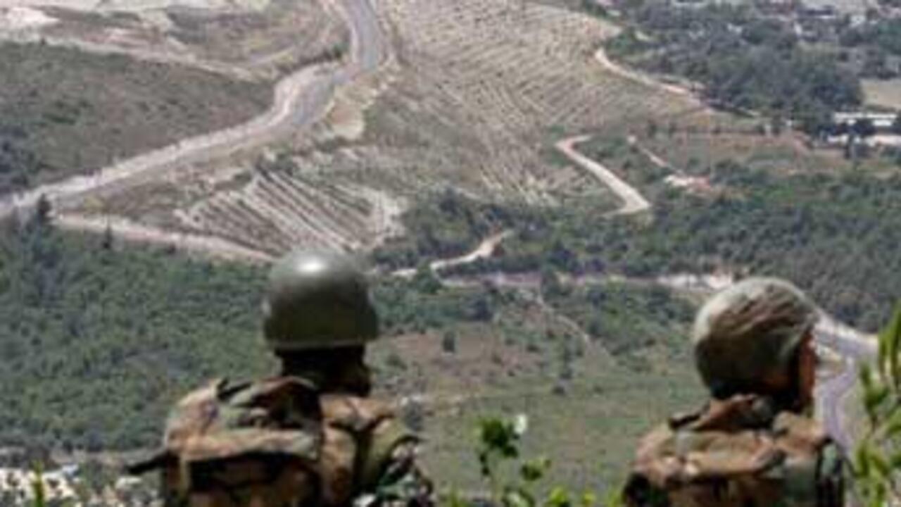 Residents brace for raids as tanks surround Hama