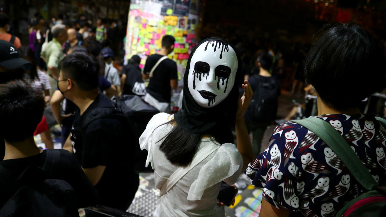 Defiant masked demonstrators protest Hong Kong face cover ban