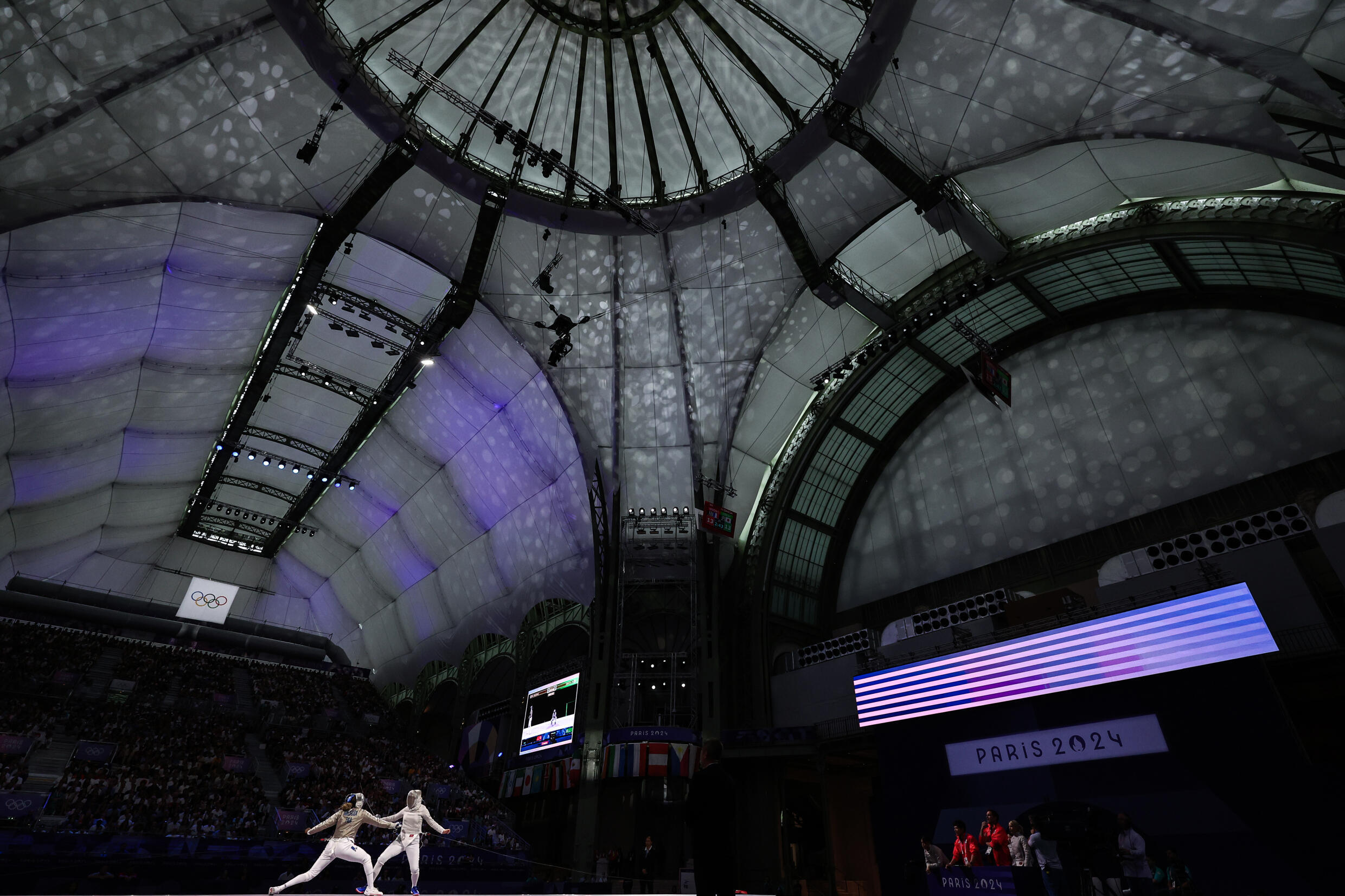 After months of grumbling, Parisians join the Olympics party