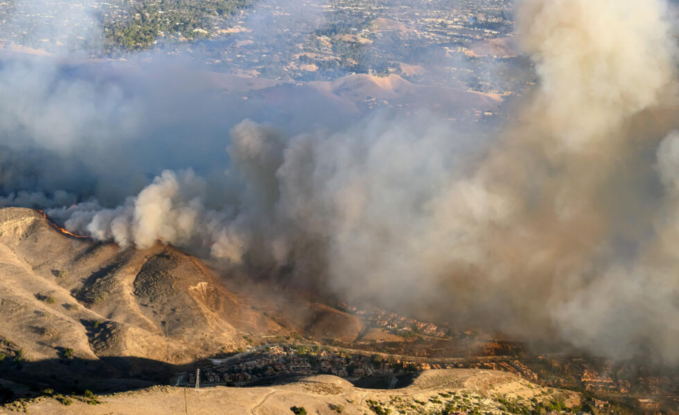 Air tankers fight Los Angeles fires from frantic skies