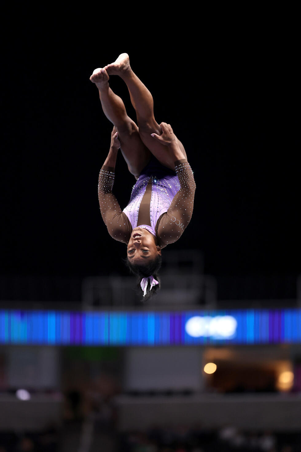 Biles leads US gymnastics championships at halfway stage