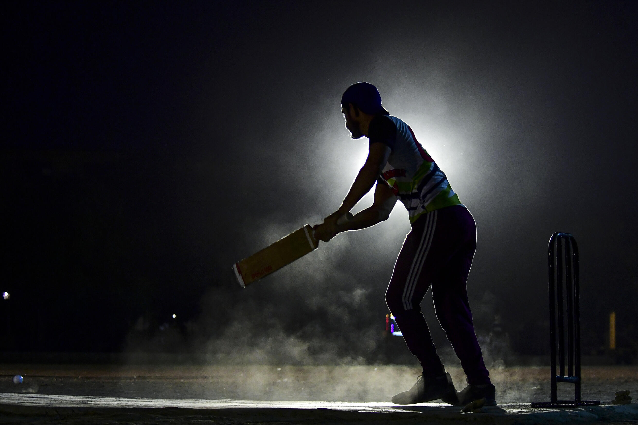 Pakistan street cricket comes to life after dark during Ramadan