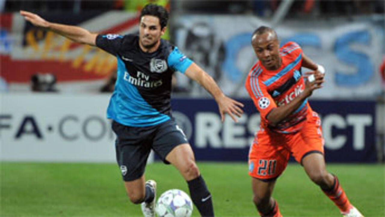 Arsenal strike late to leapfrog Marseille