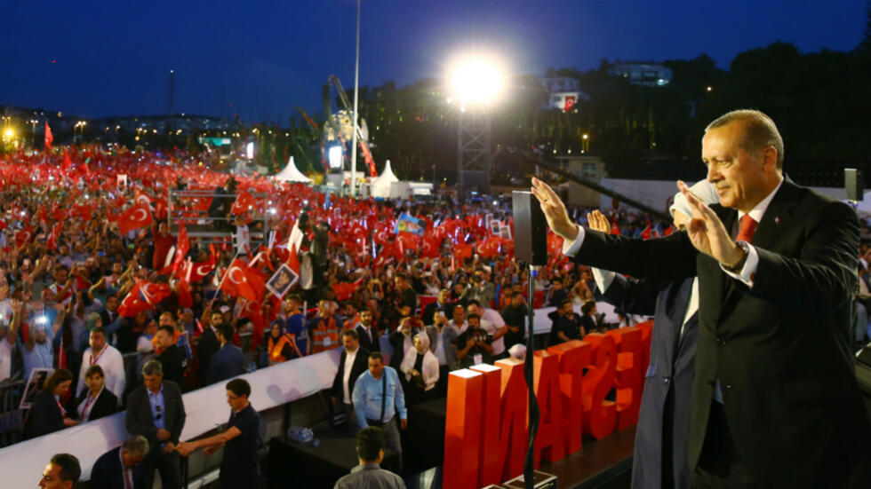 Erdogan threatens to 'chop off' traitors' heads in coup anniversary speech