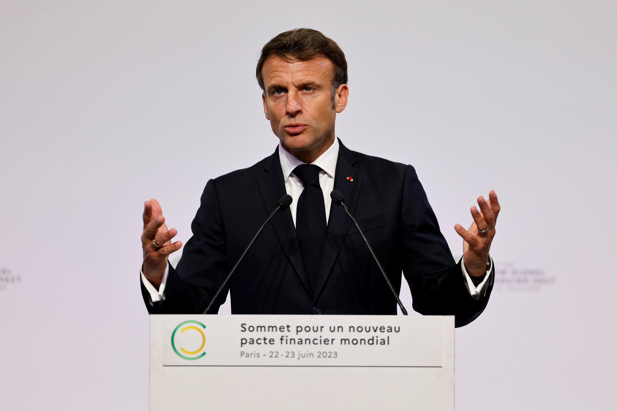 Macron says global lending system must adapt to fight climate change at ...