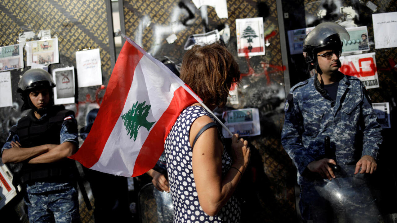 Lebanon's protesters, leaders hold parallel national day rallies