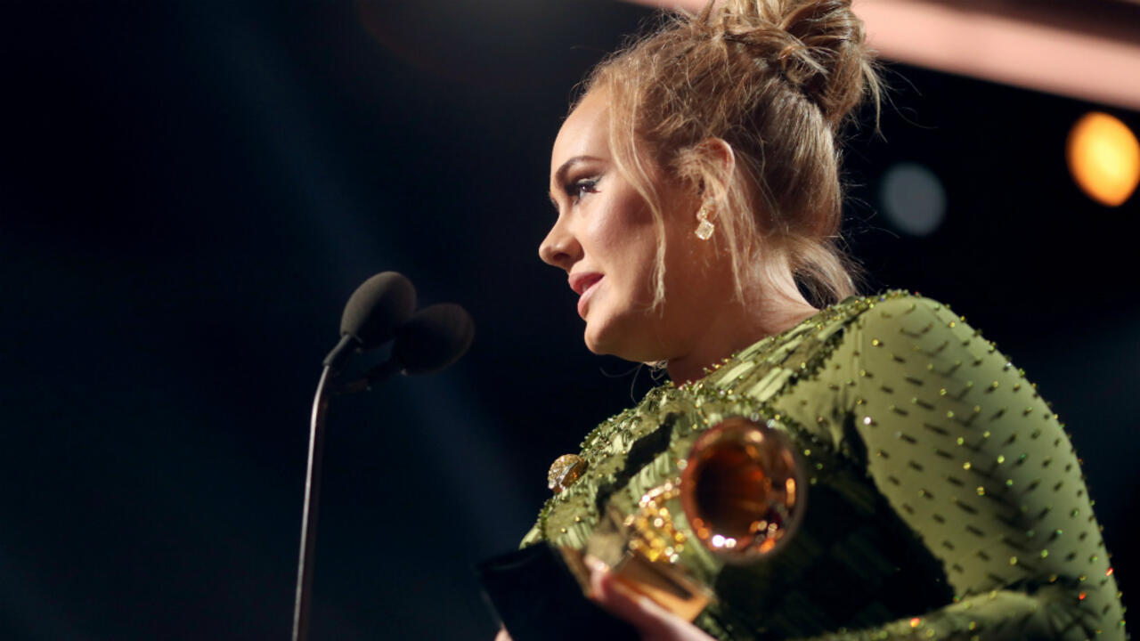 Adele beats Beyonce to top Grammys as Bowie honoured