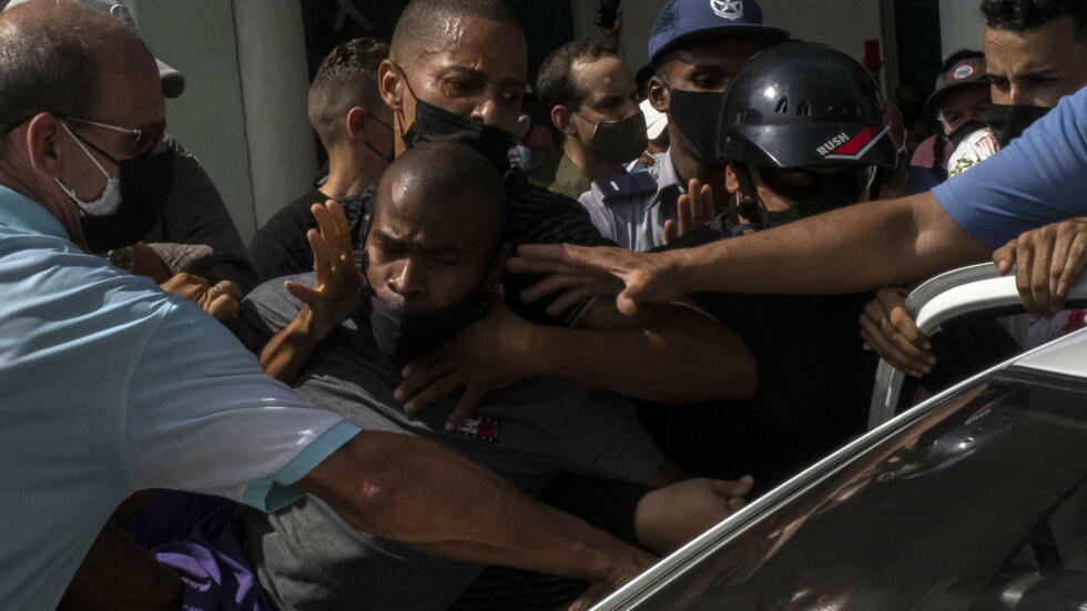 One dead, more than 100 arrested after anti-government protests in Cuba