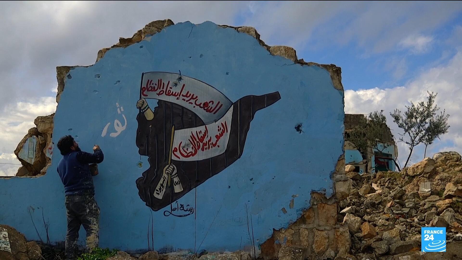 13 years on, Syrians in Idlib uphold revolution through street art, sky ...