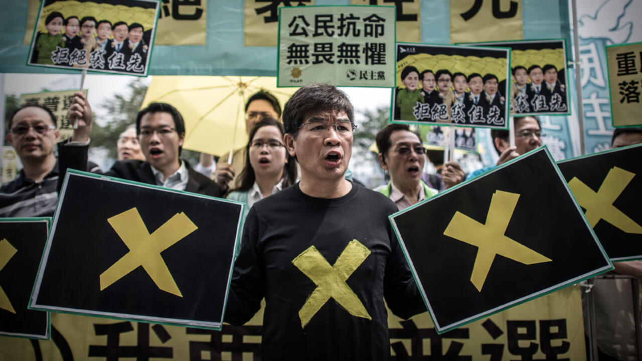 Hong Kong unveils vote plan, pro-democrats walk out