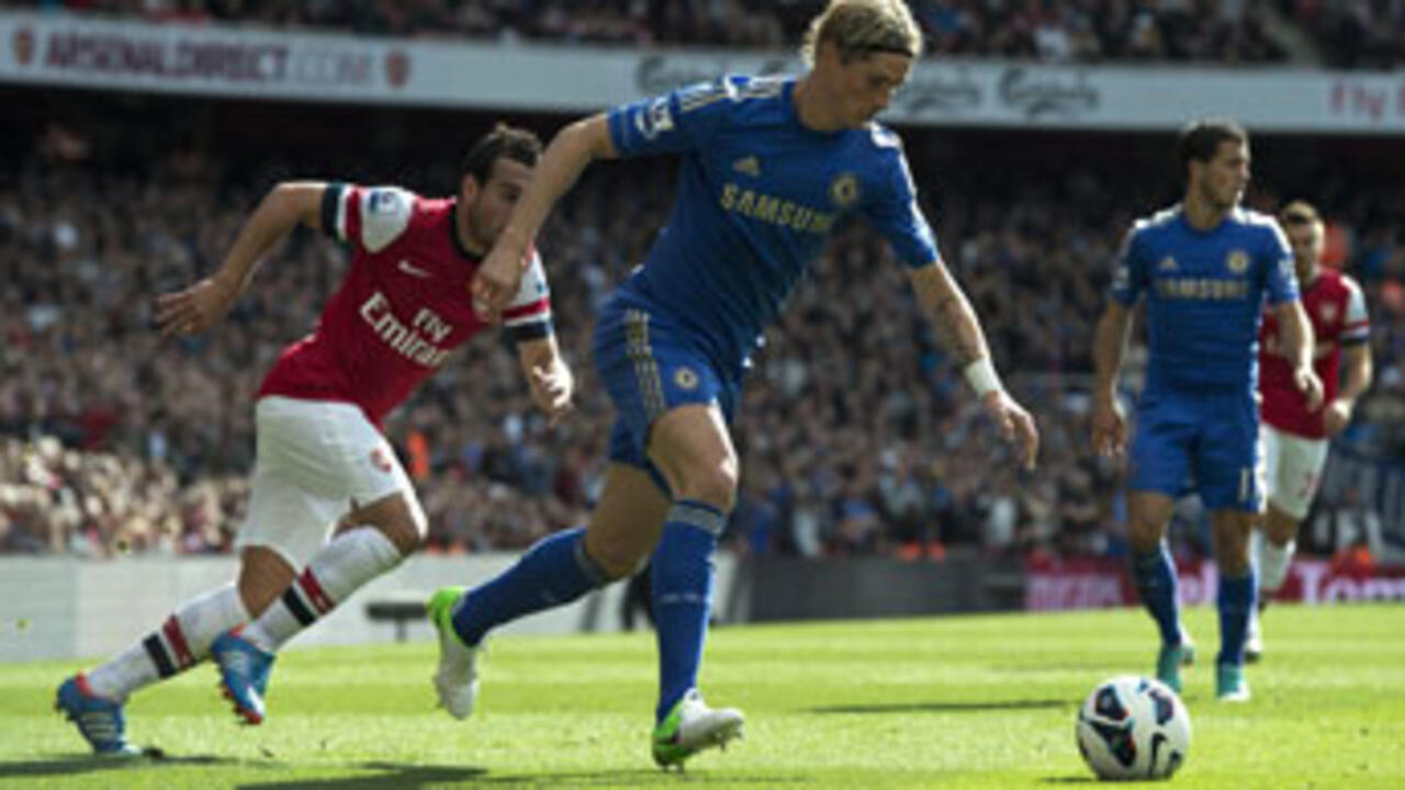 Chelsea beat Arsenal 2-1 to cement top spot
