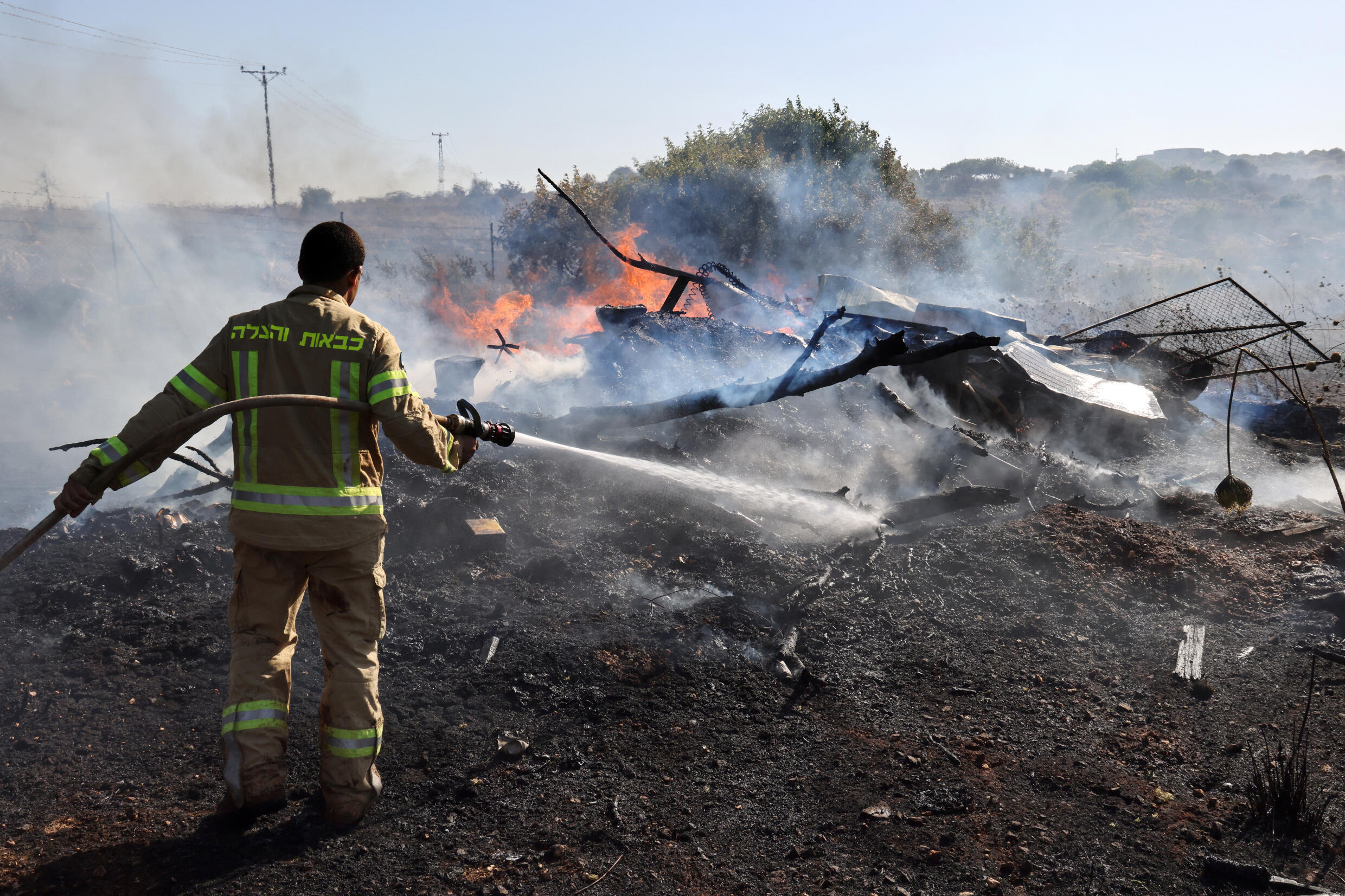 Brush fires sparked by rockets from Lebanon blaze in north Israel