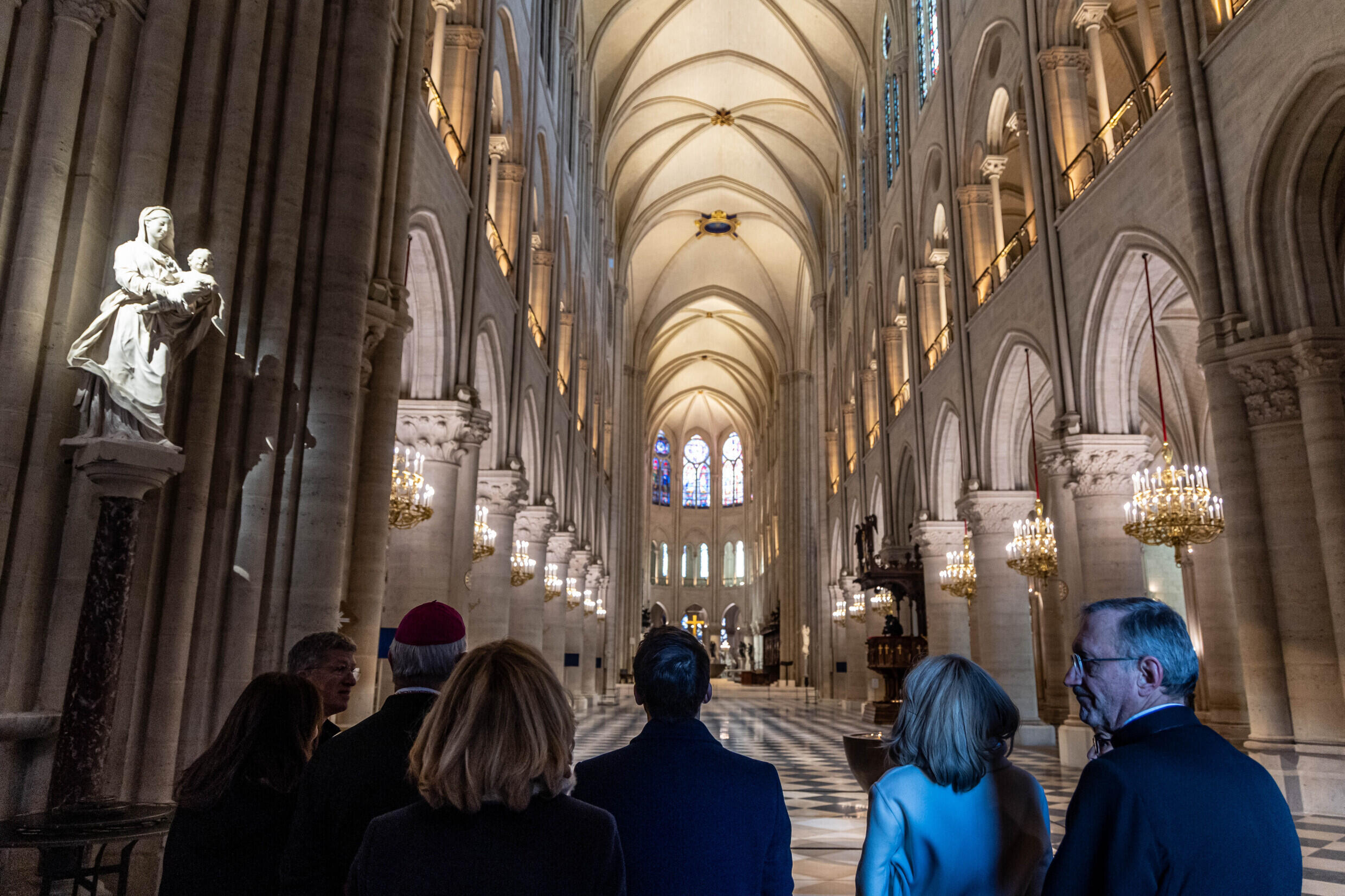 Political storm clouds Macron's Notre Dame glory