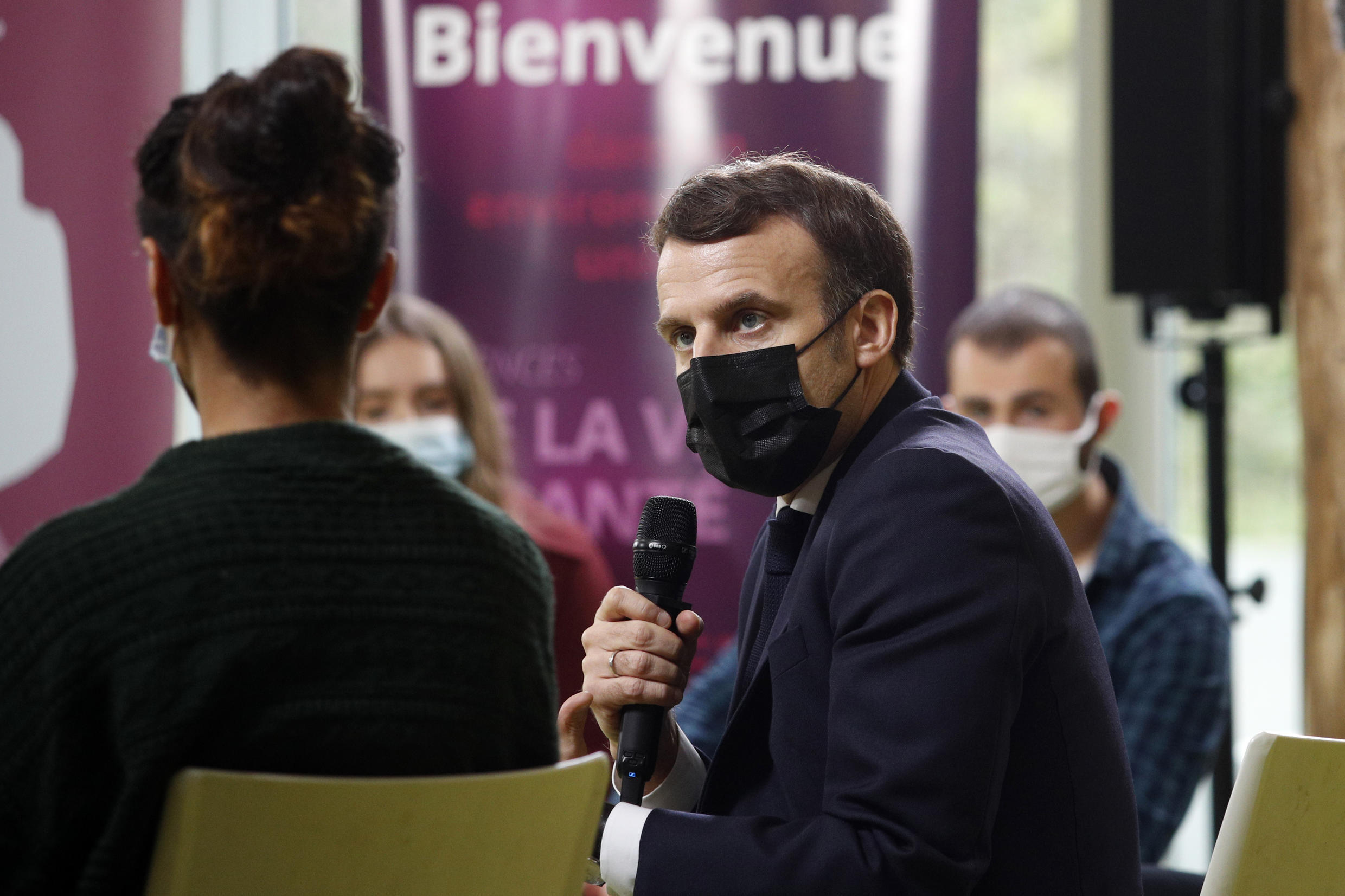 Covid-19 restrictions to remain in place, Macron warns protesting students