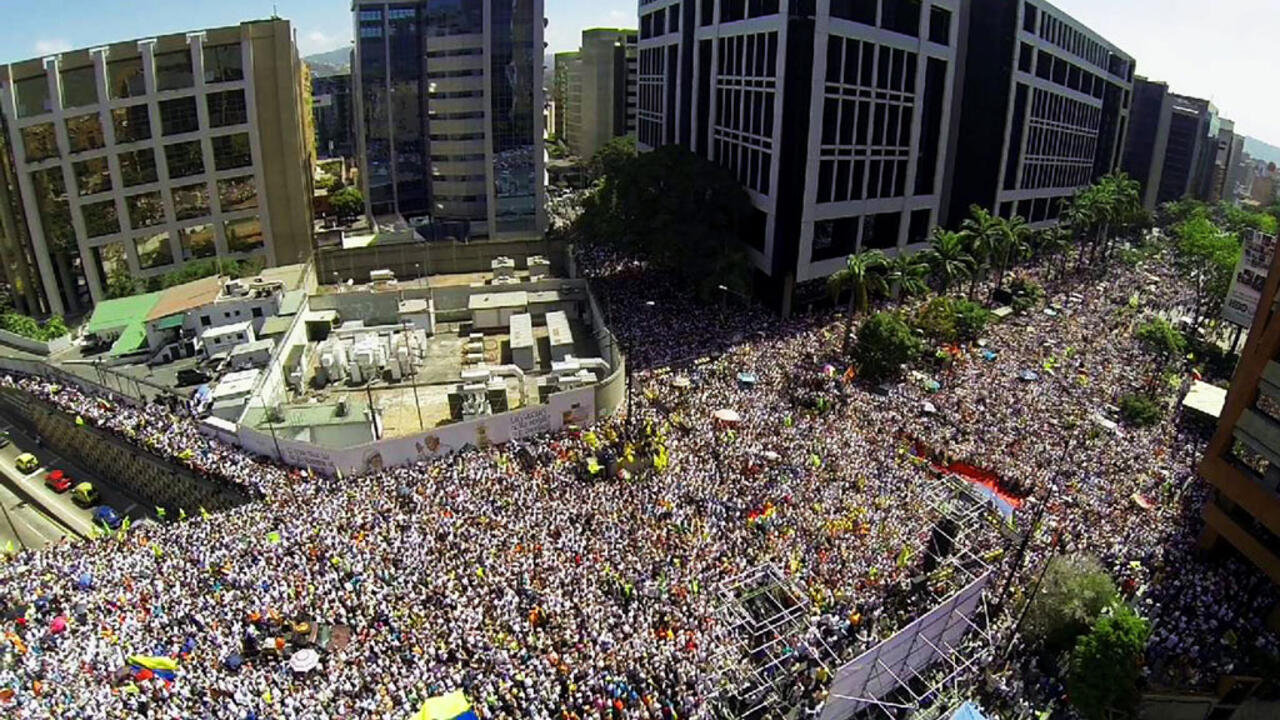 New police crackdown as 20,000 march in Caracas