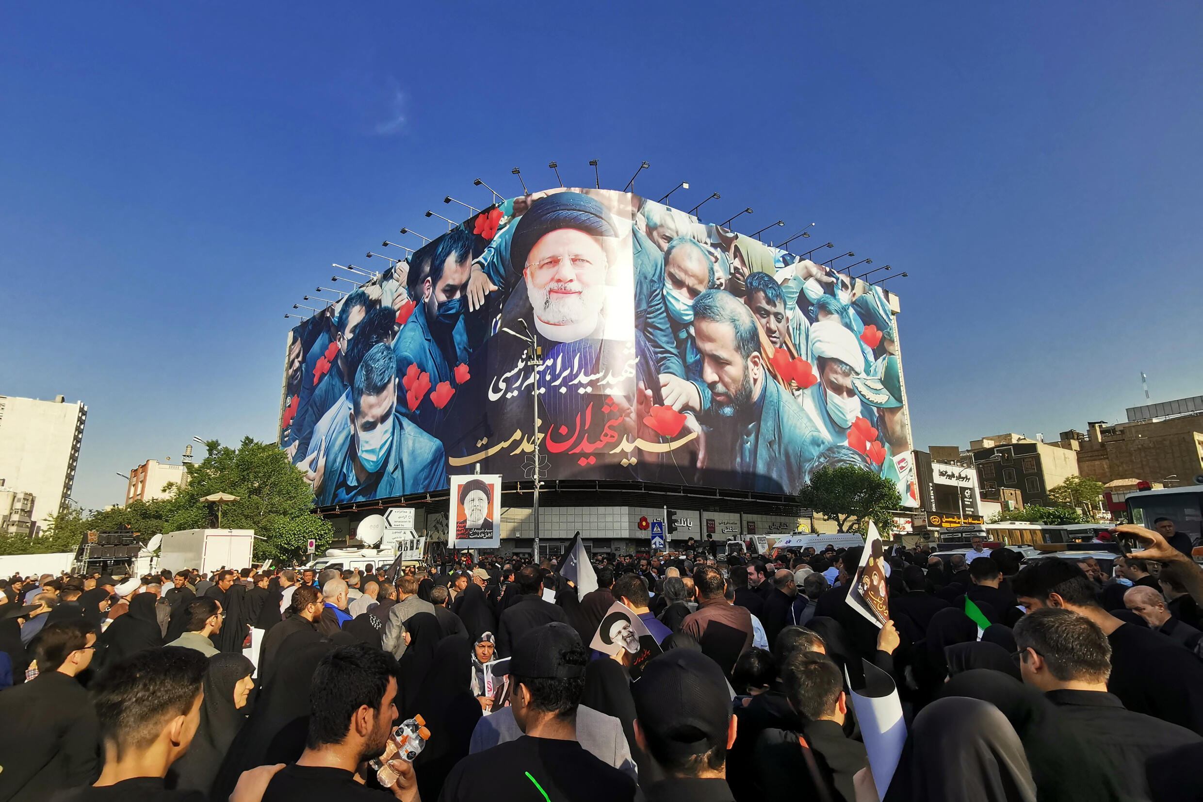 Iran’s late president Raisi buried in hometown as tens of thousands mourn