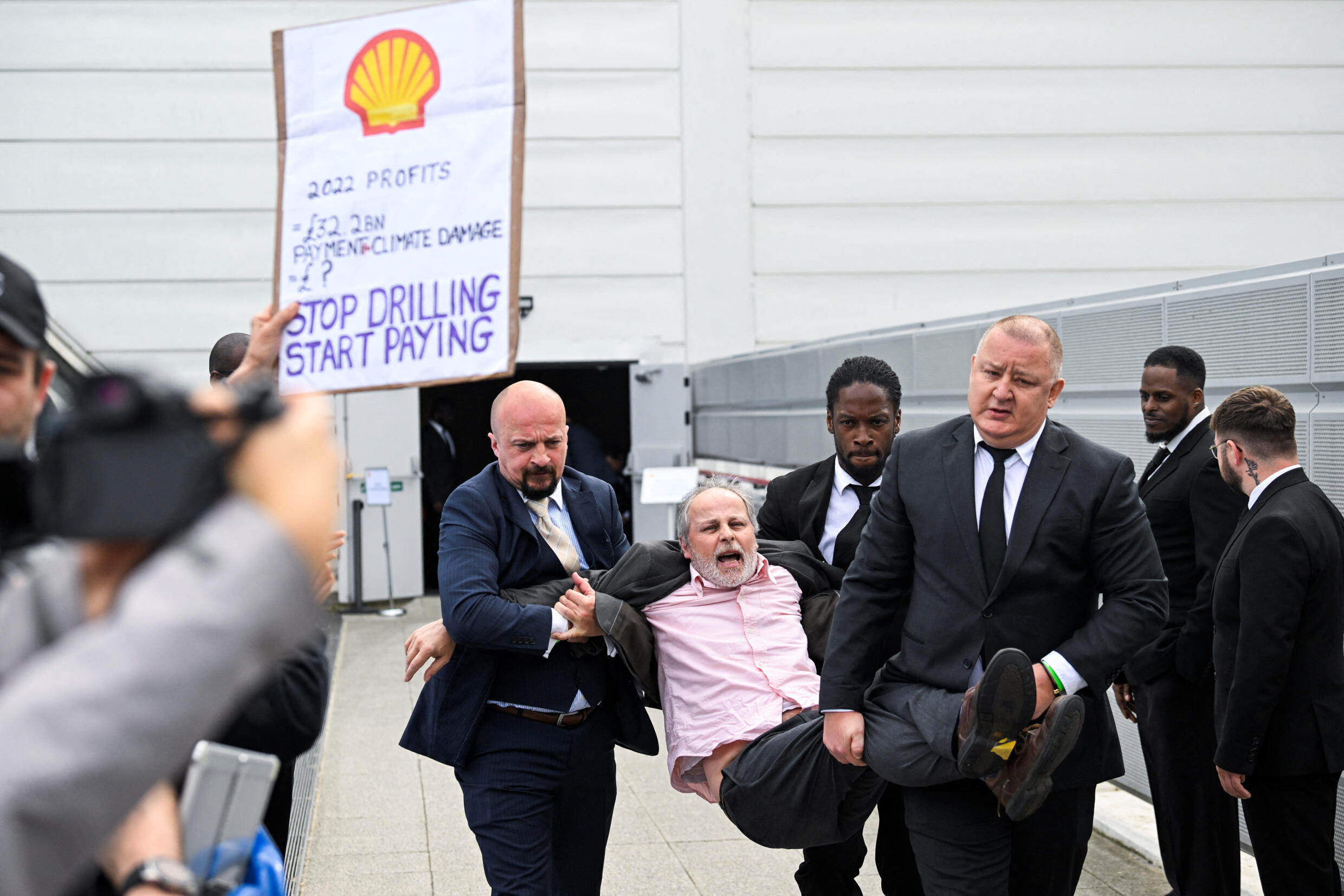 'Go to hell, Shell': More than 100 climate activists storm annual ...