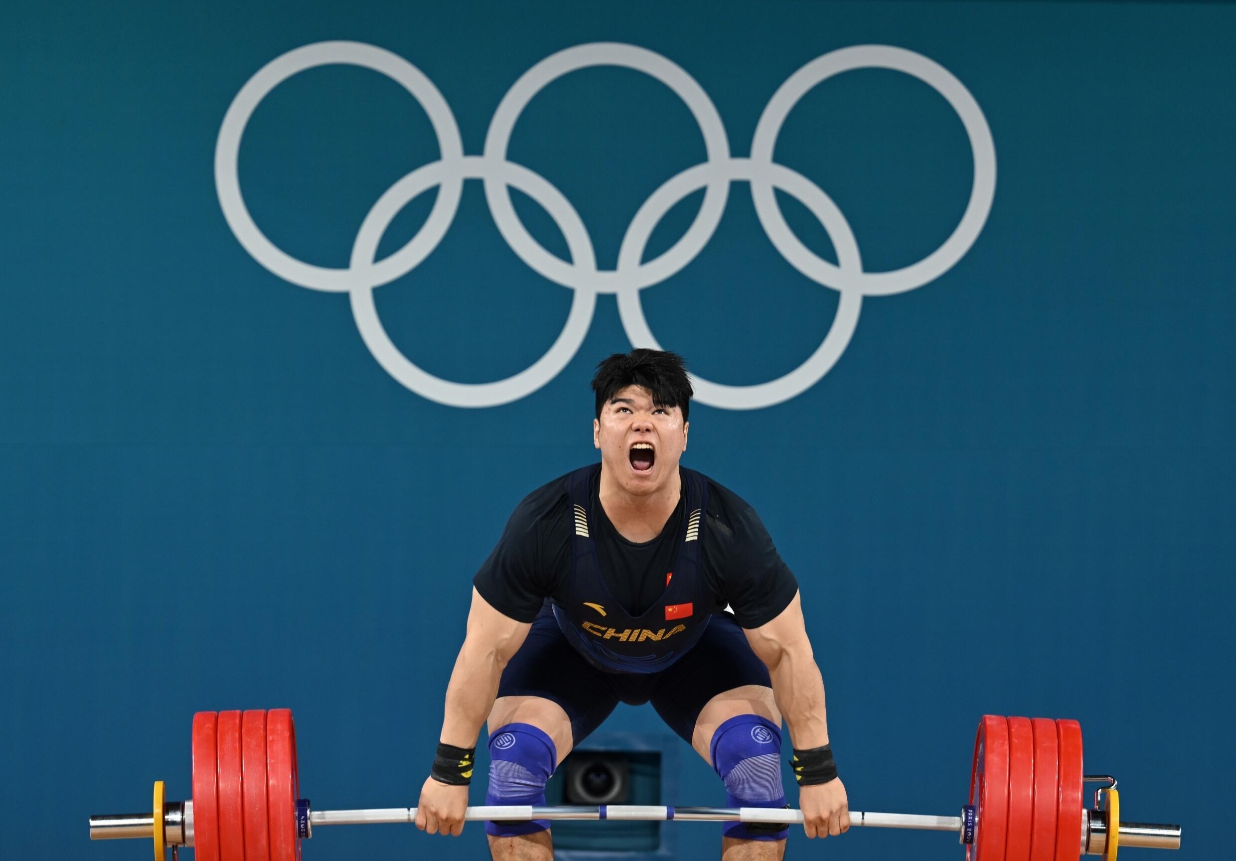 Talakhadze stays strong to retain weightlifting title
