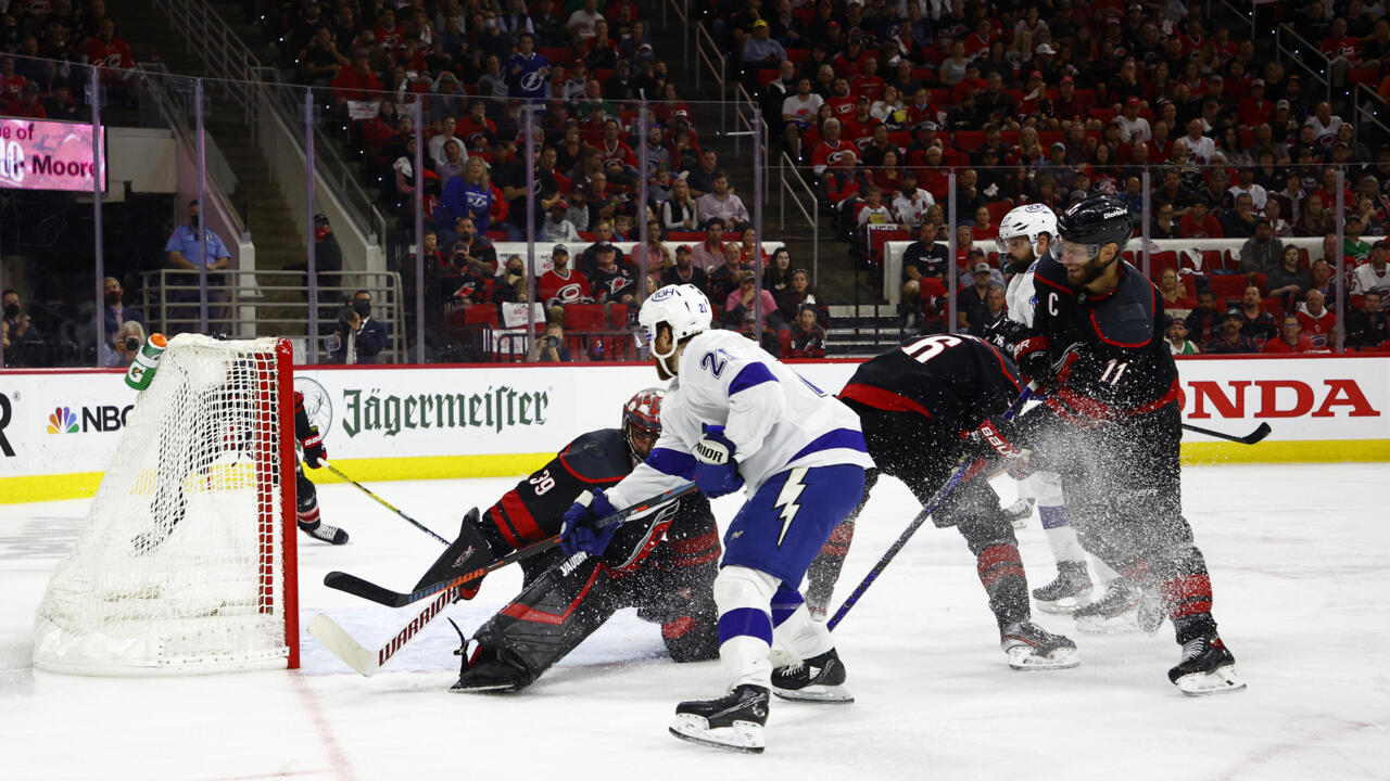 Defending champion Lightning oust 'Canes to reach NHL semi-finals ...