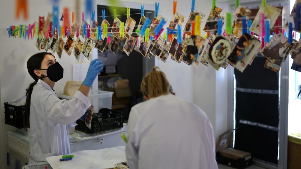 After deadly floods, Spaniards fight to save photos