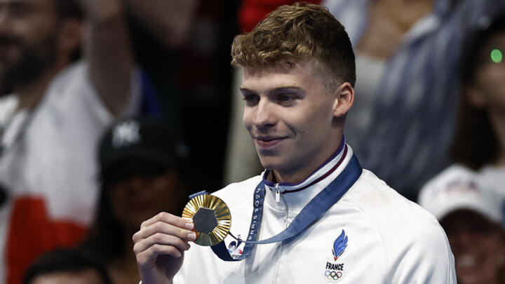 French swimmer Marchand wins gold with Olympic record in men’s 400 ...