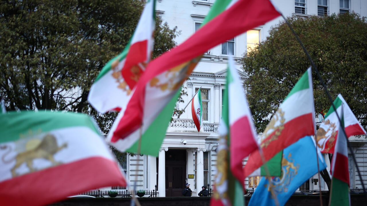 Protester put pre-Islamic revolution Iran flag on London embassy: witnesses