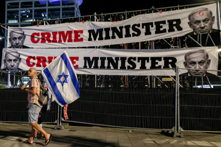 Netanyahu fights for political survival to beat of war drums