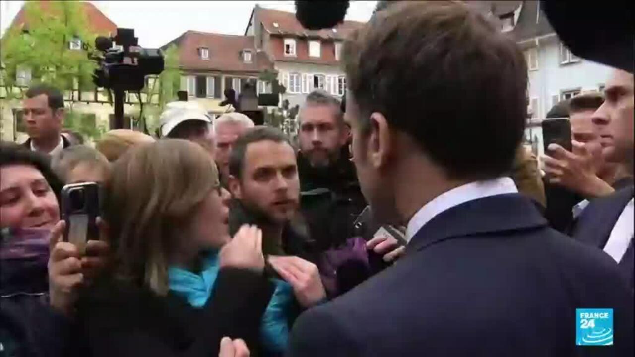 French Pension reform: Macron booed by angry crowd after signing bill ...