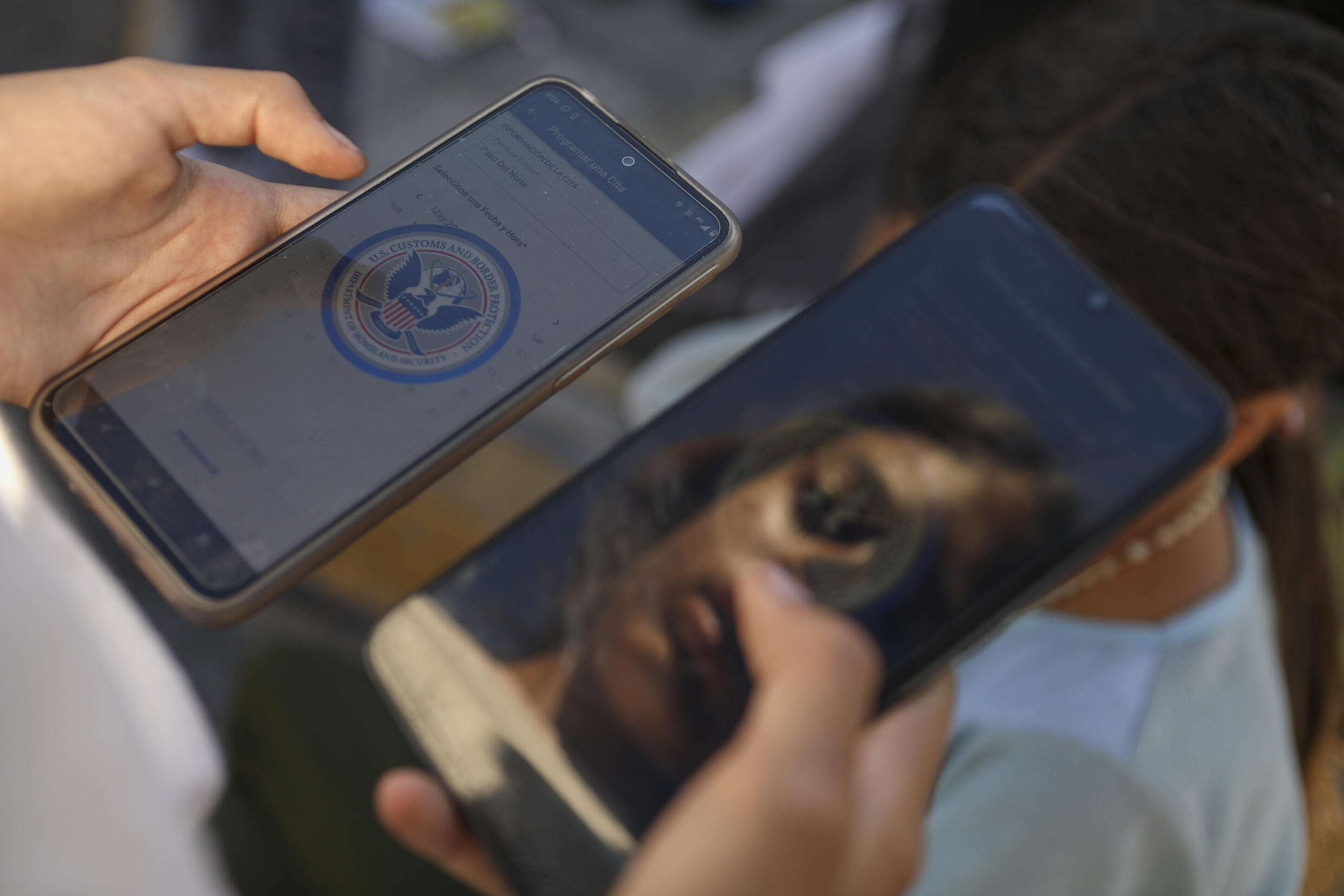 'A game of chance': Migrants battle glitchy app at US border