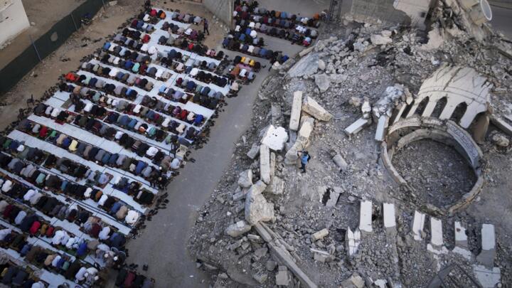 Palestinians in Gaza mark Eid with outdoor prayers in the rubble ...