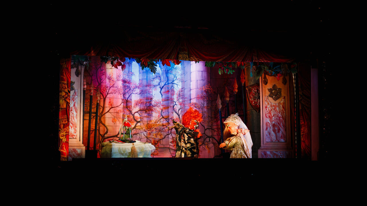 Curtain drops for Eiffel Tower puppet theatre before Paris Games