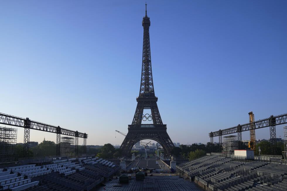 Olympic rings mounted on Eiffel Tower with 50 days to go until Paris Games