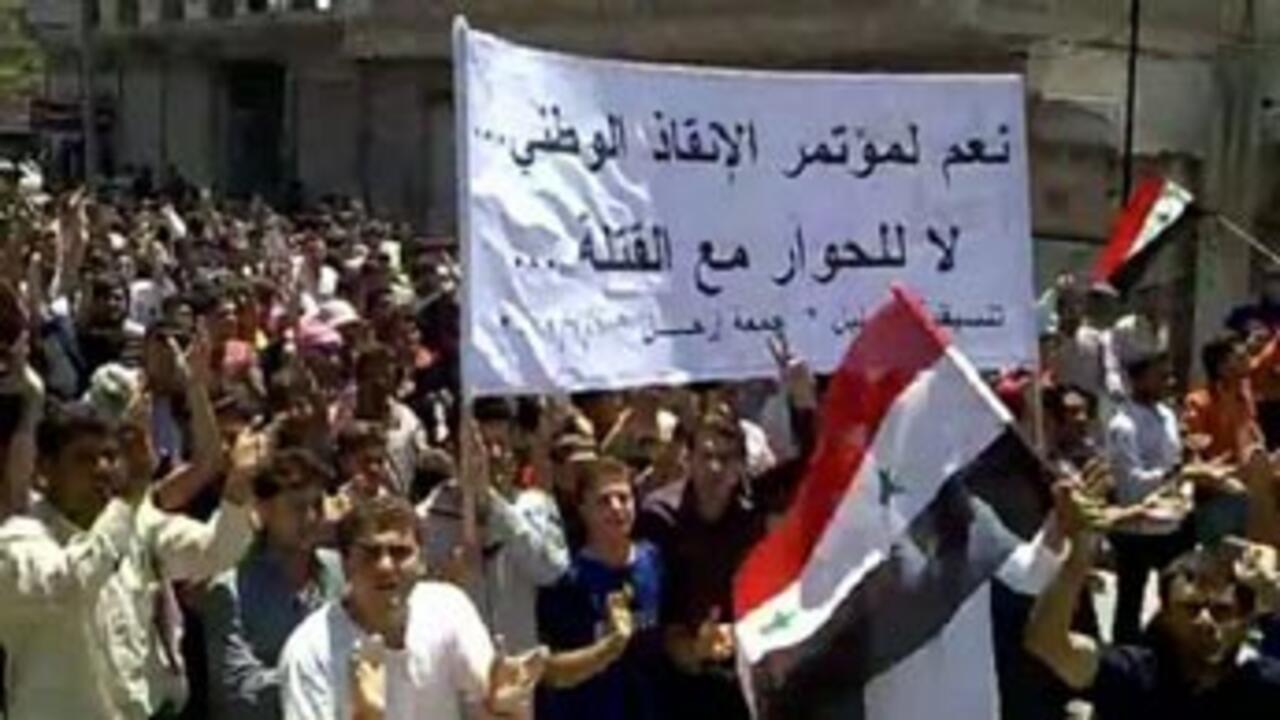 Troops storm Hama as defiant protesters march